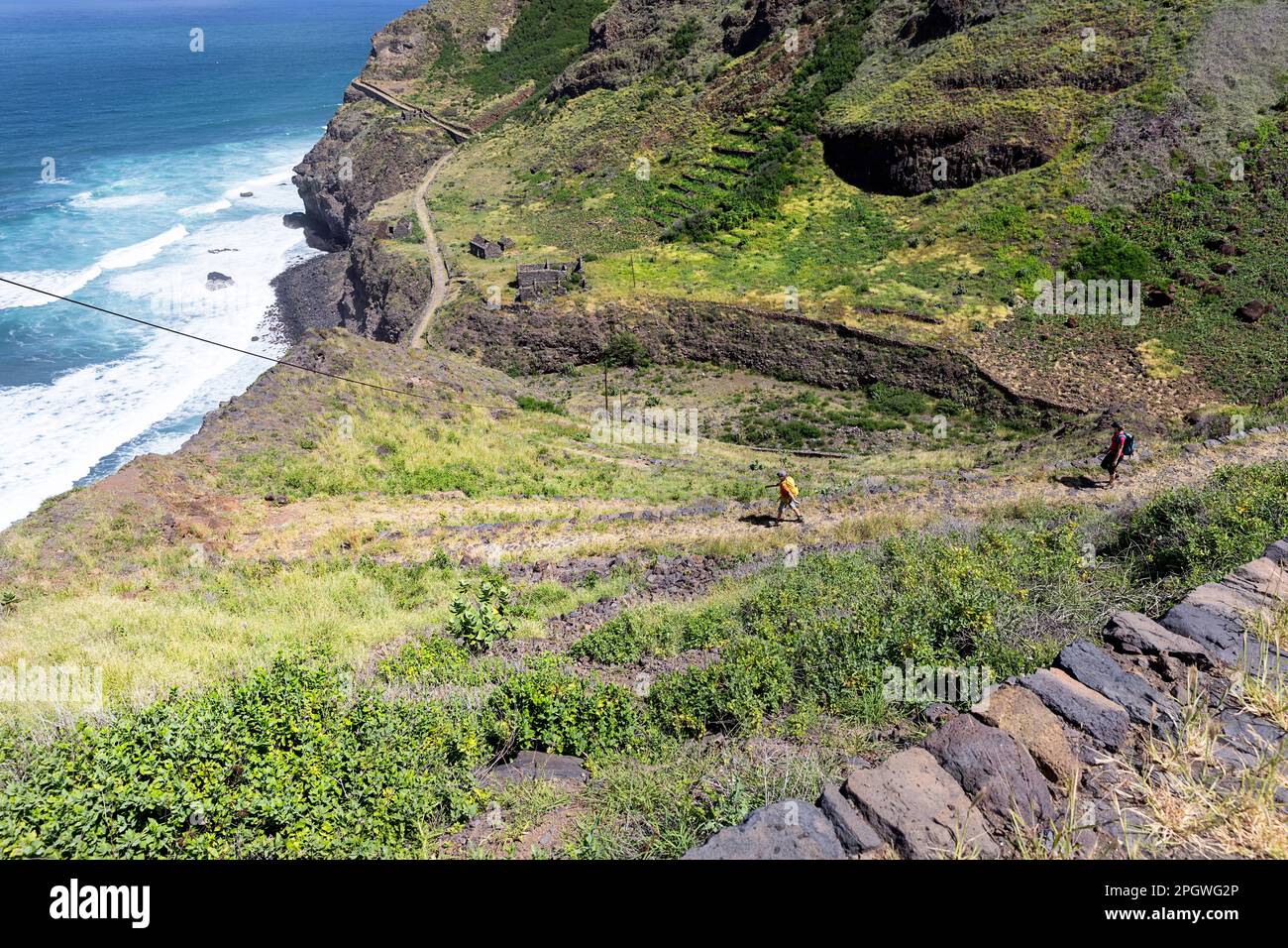 Mother and son, tourists, on a family hiking trip on a spectacular ...