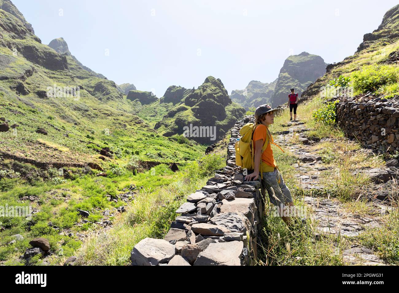 Mother and son, tourists, on a family hiking trip on a best hiking ...