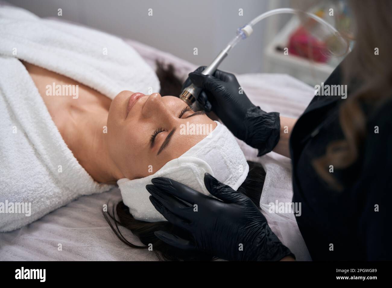 Woman working in salon, doing skin resurfacing procedure Stock Photo ...