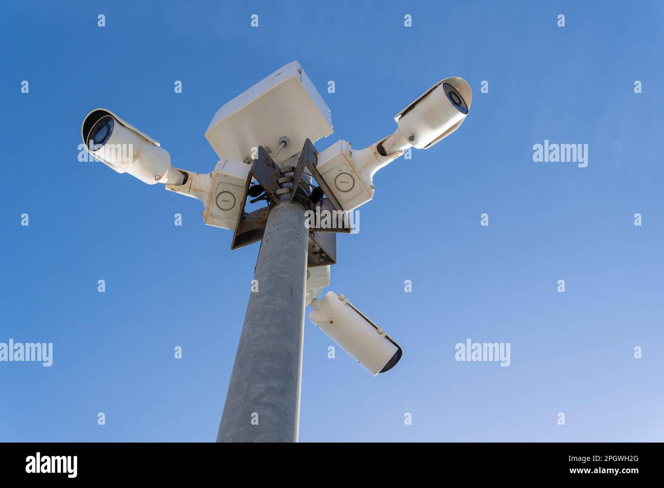 Three video surveillance security cameras in the street. Conceptual ...
