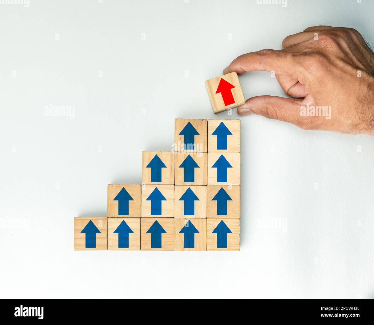 financial symbols, wooden blocks of red and blue arrows, Ladder career path for business growth ...