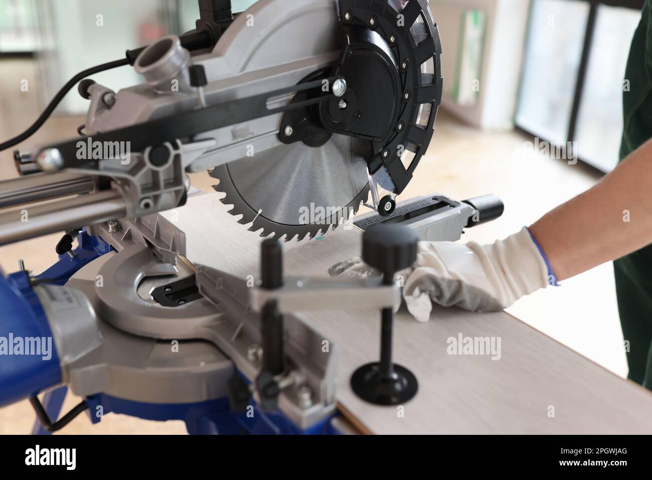Professional carpenter controls process of sawing laminate Stock Photo ...