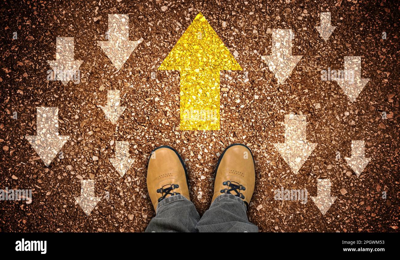 Yellow leather shoes and chalky arrows in opposite directions ...