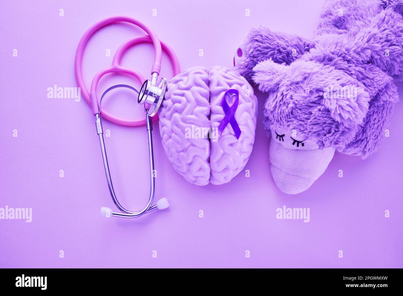 Purple day. Epilepsy awareness day. Toy bear with purple ribbon Stock ...
