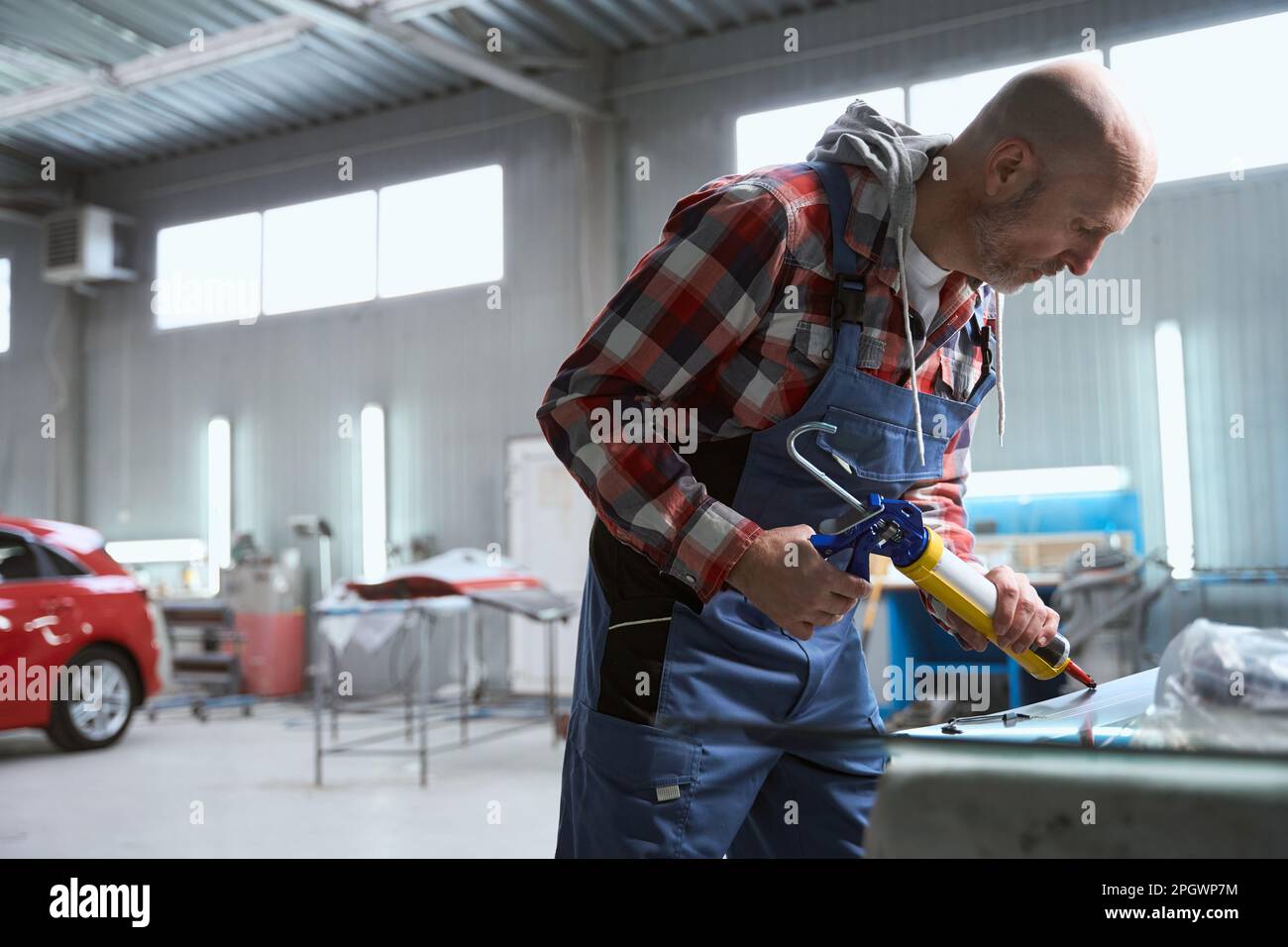 Repairman in car service uses hi-res stock photography and images - Alamy