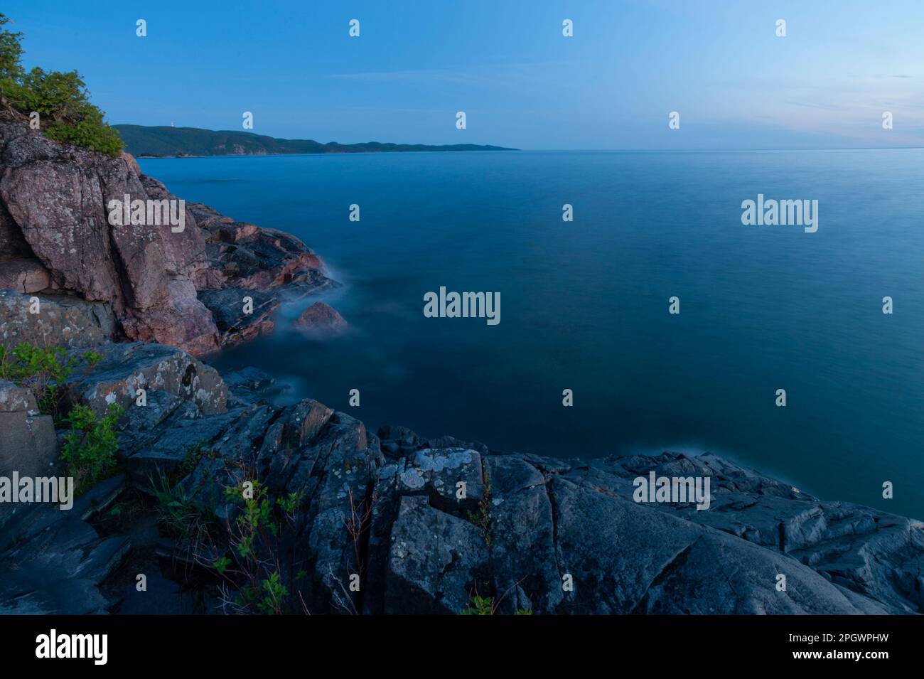 Dusk over the granite rocks of the Canadian Shield rocks and the waters ...