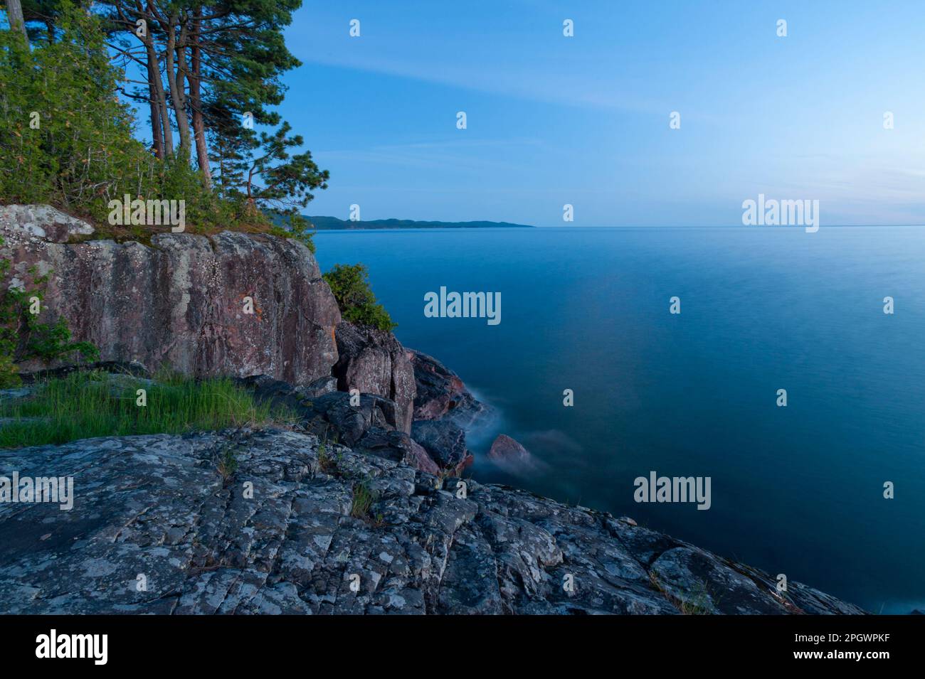 Dusk over the granite rocks of the Canadian Shield rocks and the waters ...