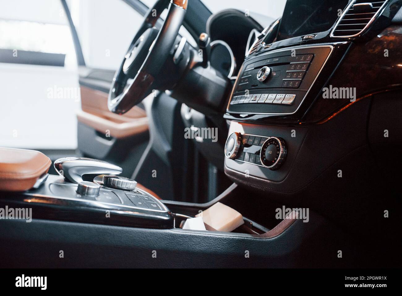 Inside of brand new modern black automobile. Front control panel Stock ...