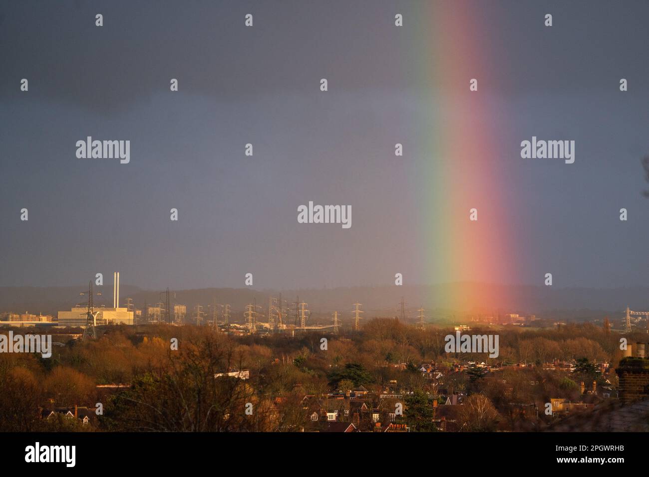 London UK 24 March. 2023. The end of colourful rainbow appears over ...