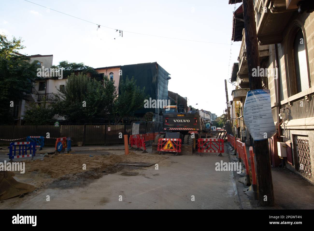 Construction workers at construction site and heavy duty bulldozer in ...