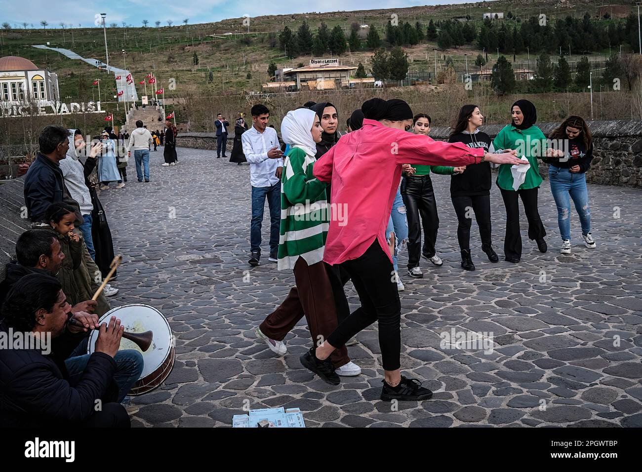 Young people seen dancing Halay on the bridge. The Tigris Bridge ...