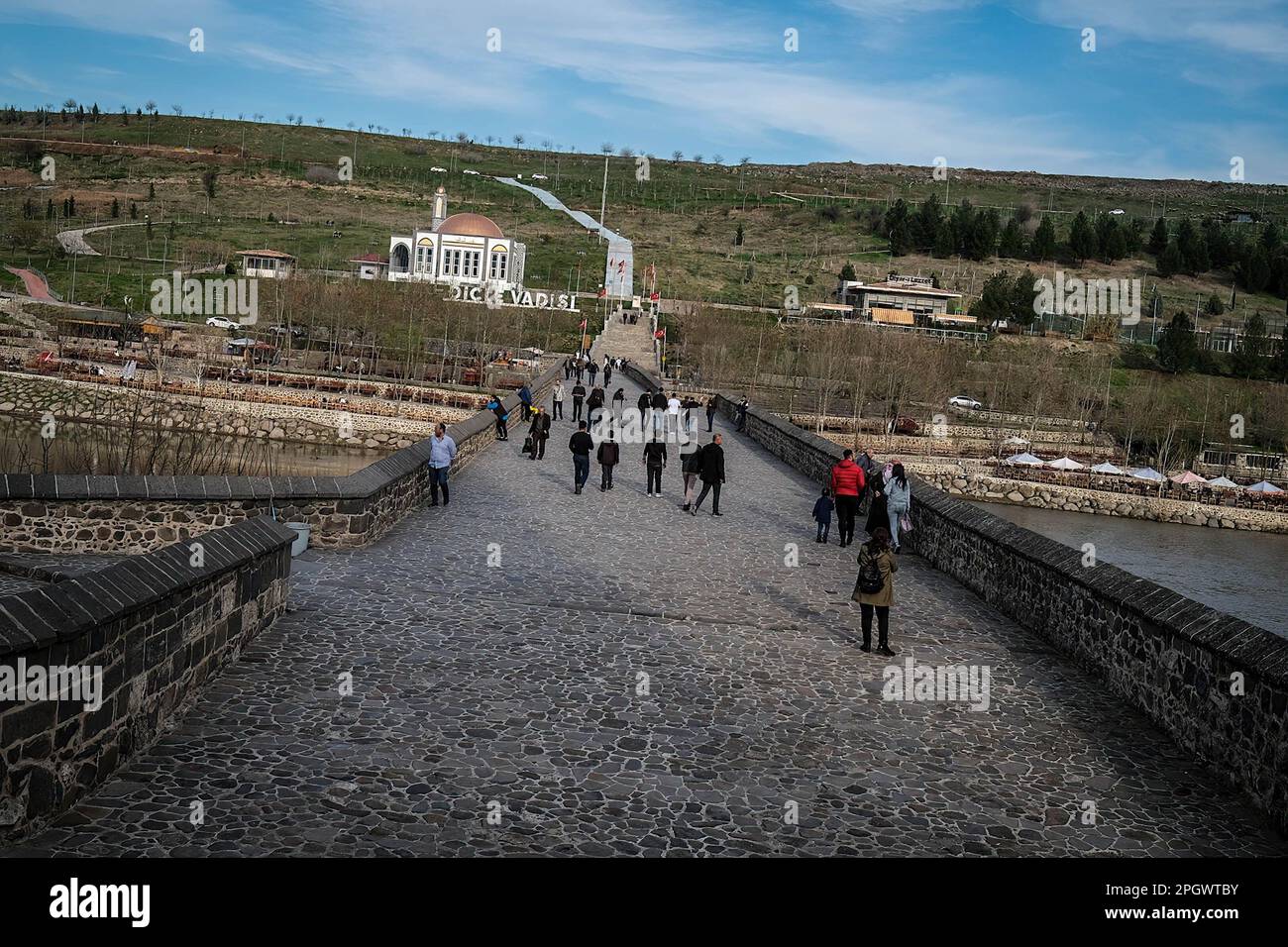 People seen on the bridge. The Tigris Bridge, popularly known as the ...