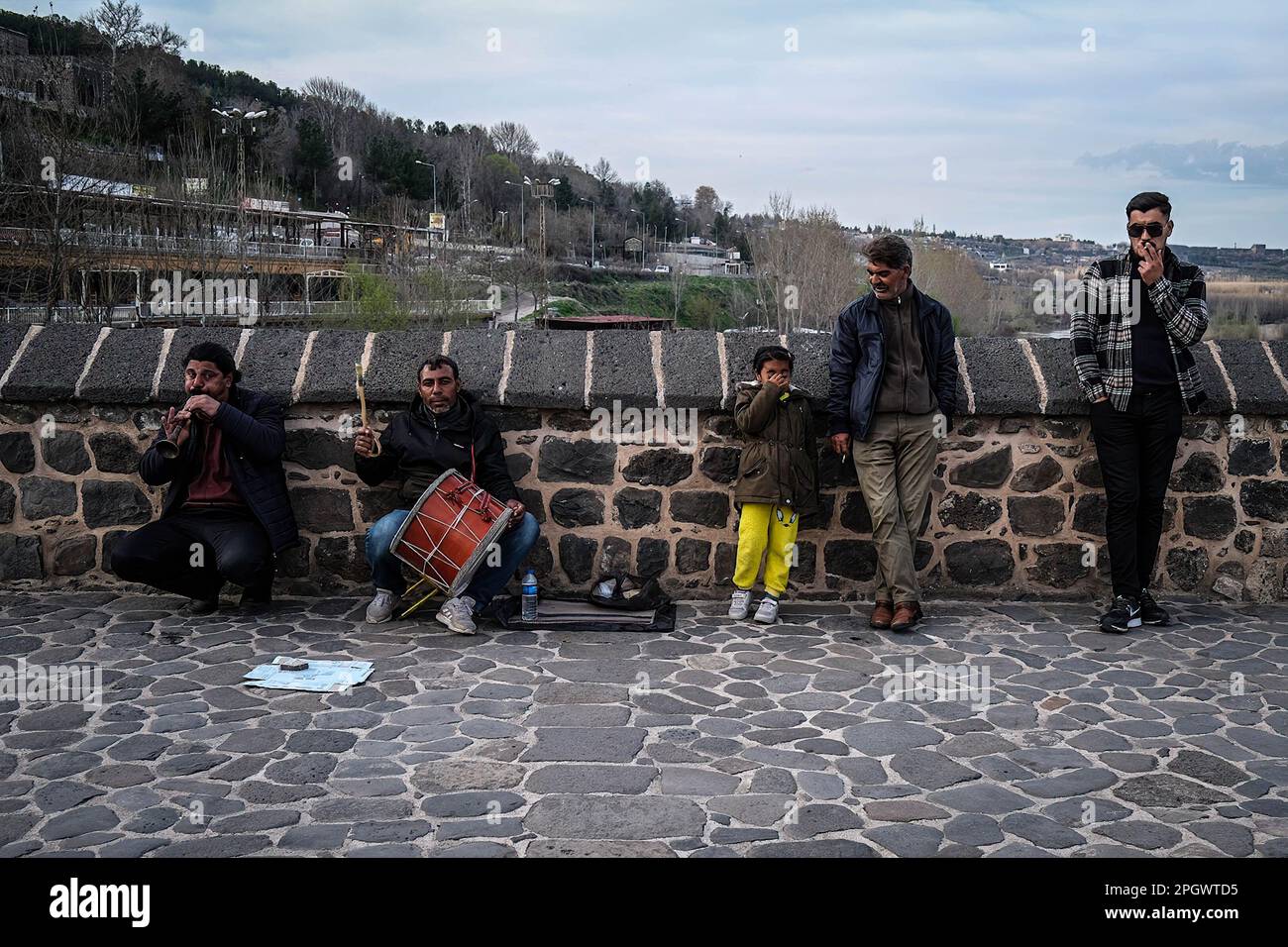 People pose for a photo on the bridge. The Tigris Bridge, popularly ...