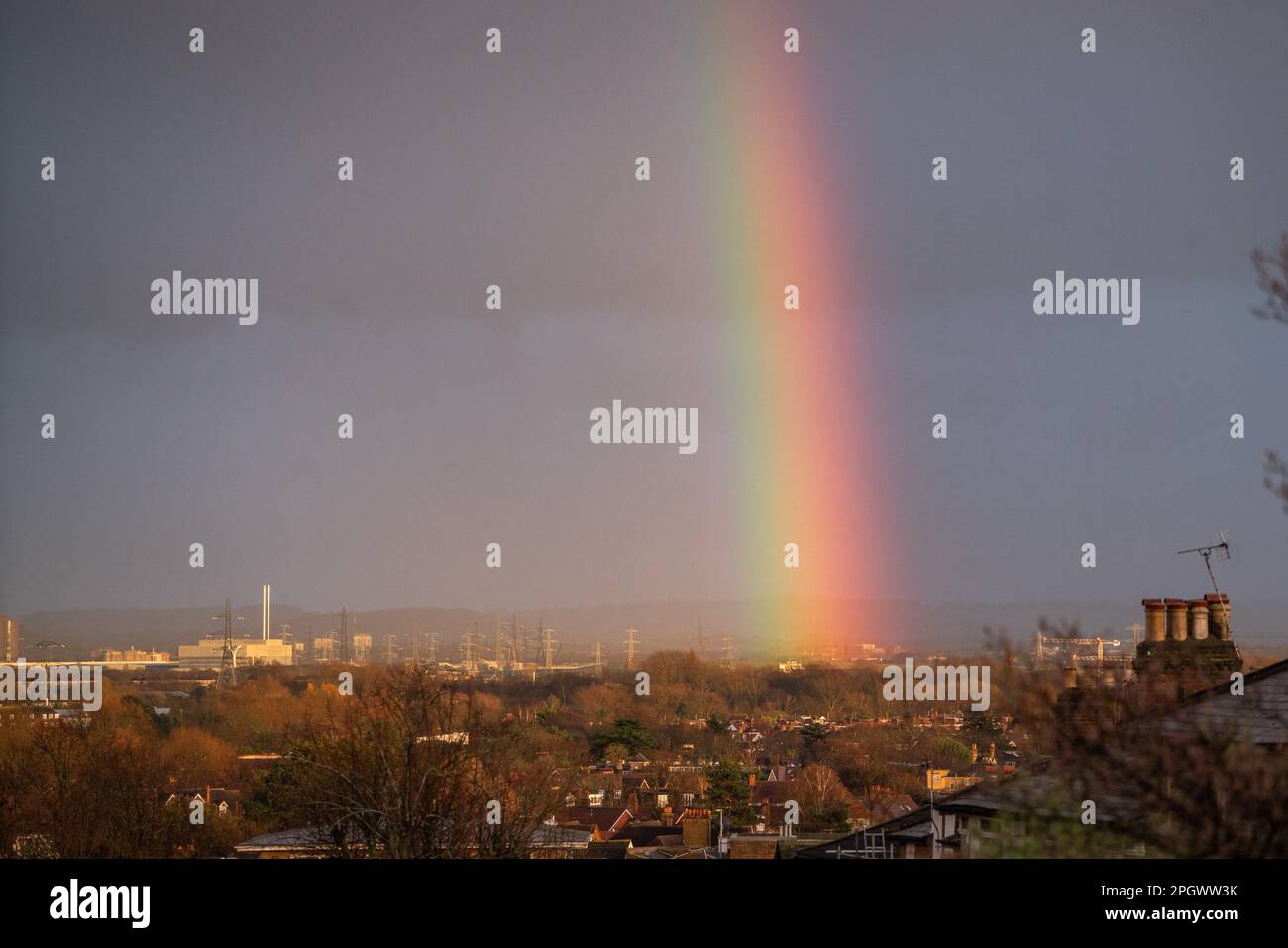 London UK 24 March. 2023. The end of colourful rainbow appears over ...