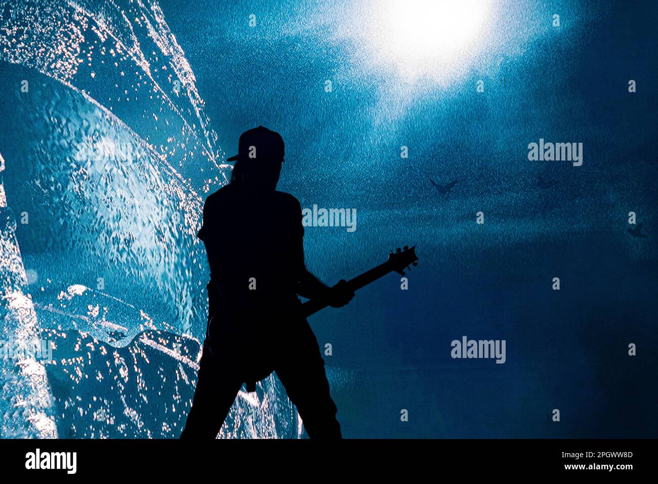 Guitarist male silhouette in backlight at a concert Stock Photo - Alamy