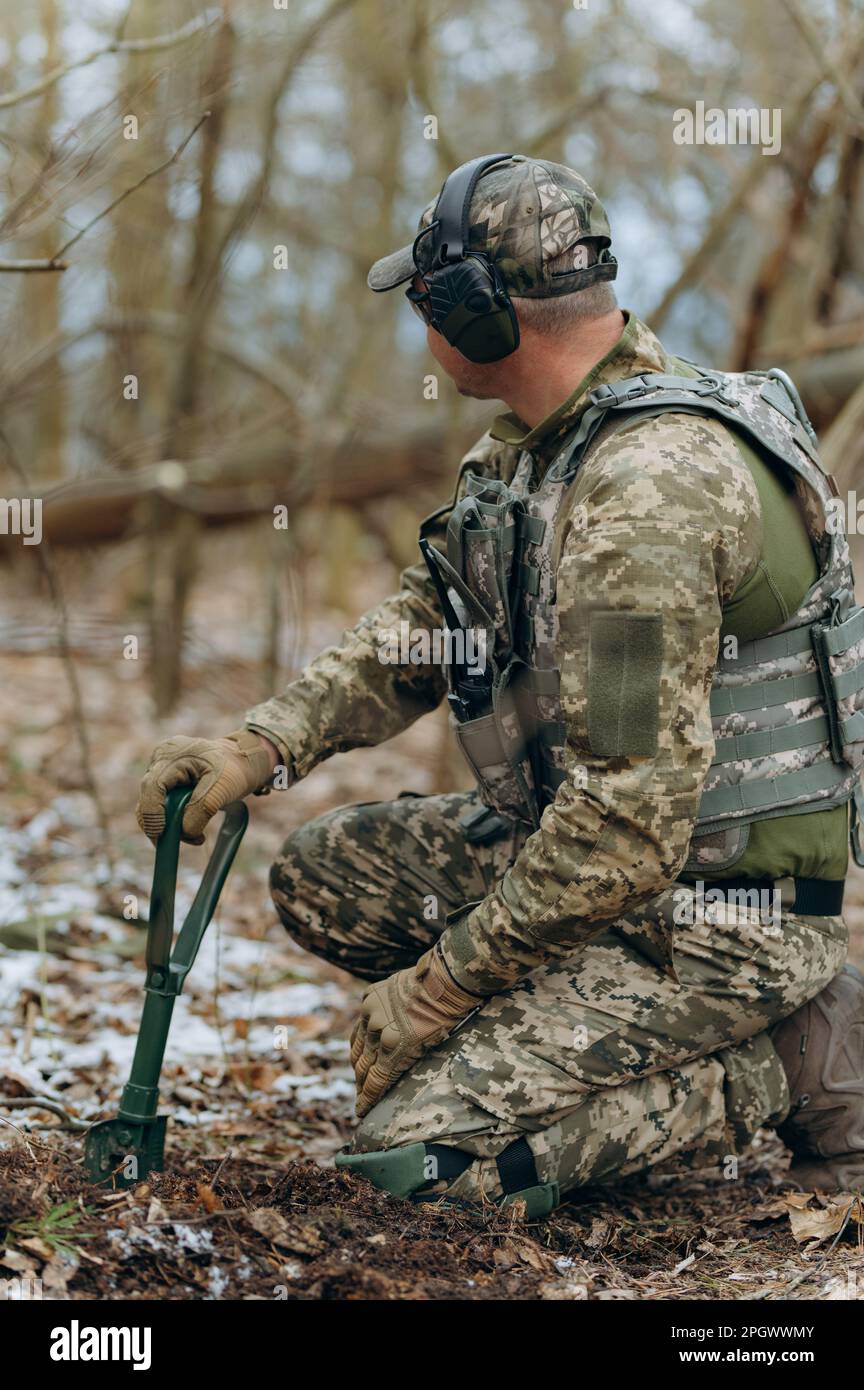 Preparation for the attack. Digging a trench Stock Photo - Alamy