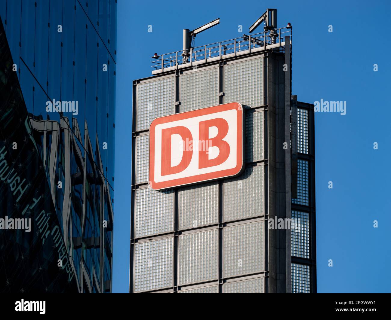 Deutsche Bahn icon on a tower next to the main station. Building ...