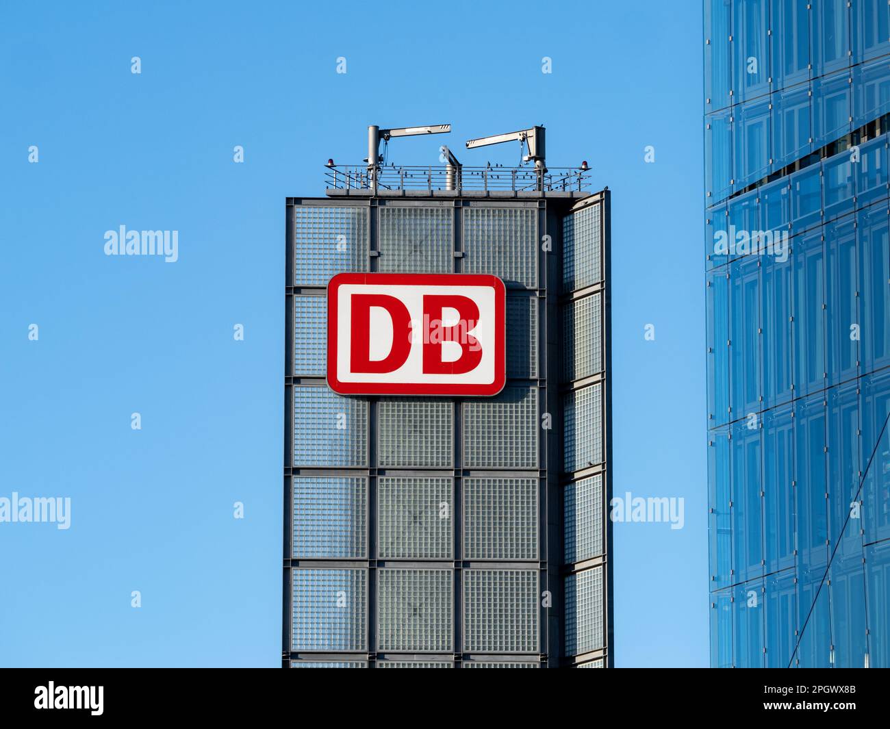 DB logo sign of the Deutsche Bahn AG on a tower building. German multi ...