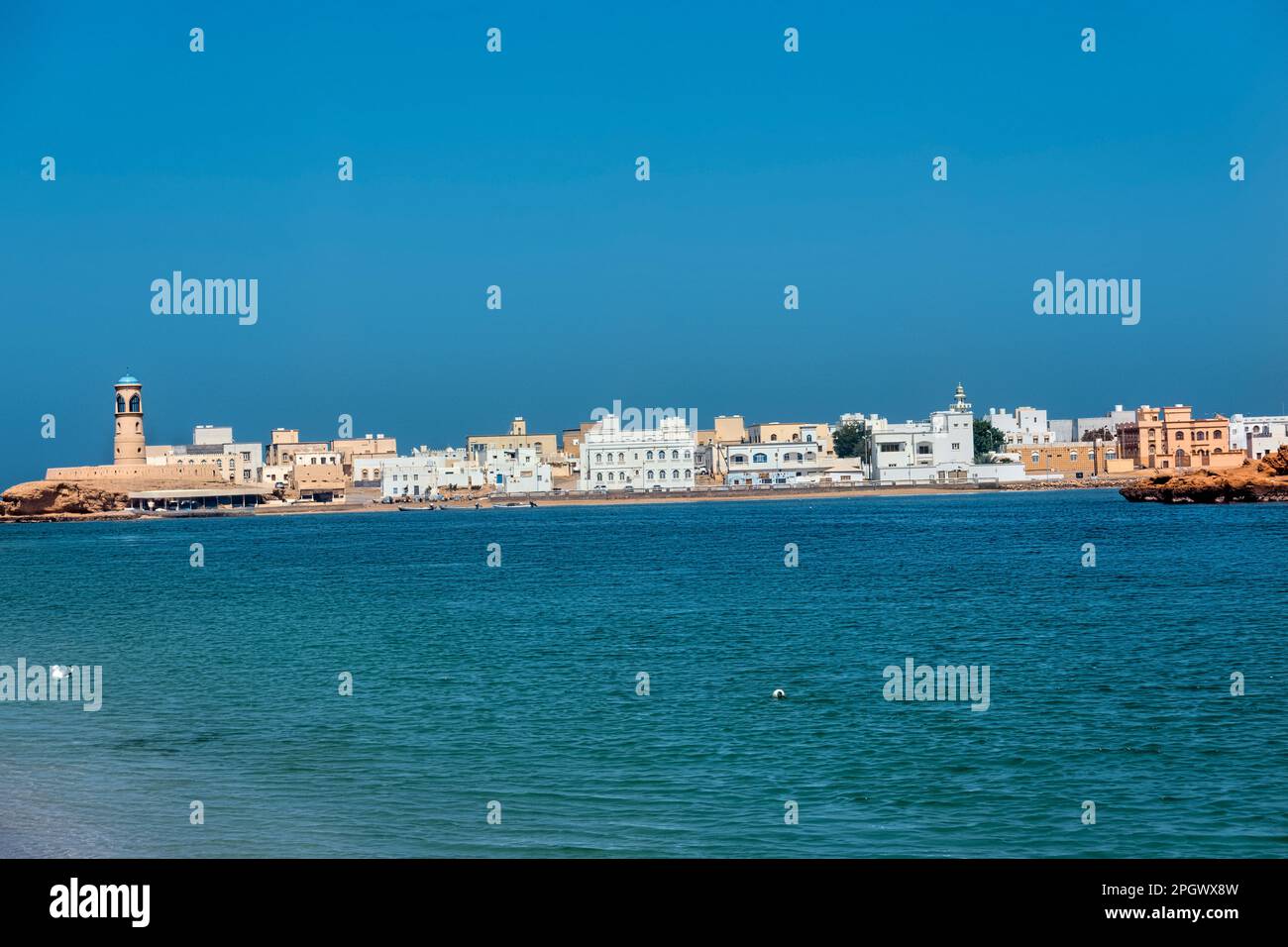The Al Ayjah lighthouse and whitewashed village in Sur, Ash Sharqiyah ...