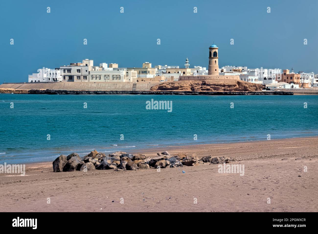 The Al Ayjah lighthouse and whitewashed village in Sur, Ash Sharqiyah ...