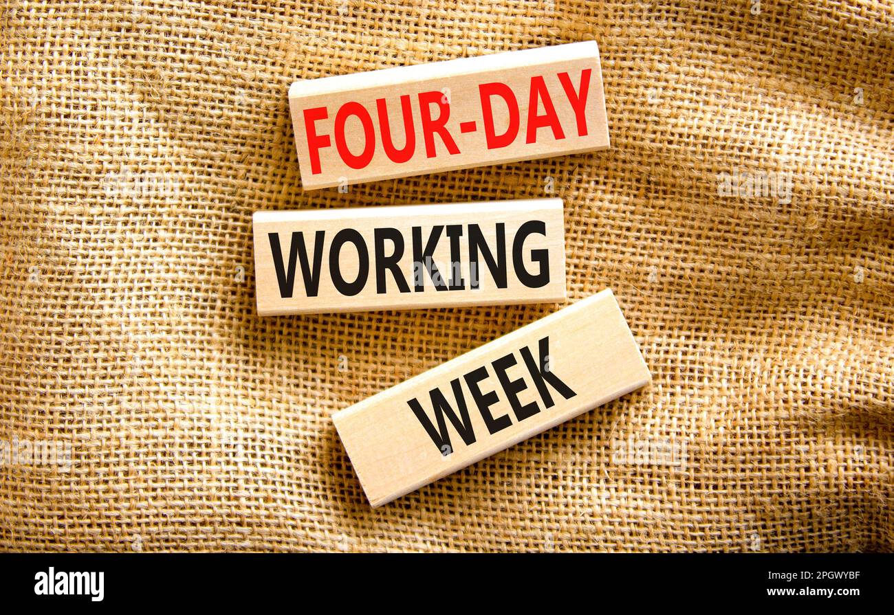 Four-day working week symbol. Concept words Four-day working week on wooden block on a beautiful ...