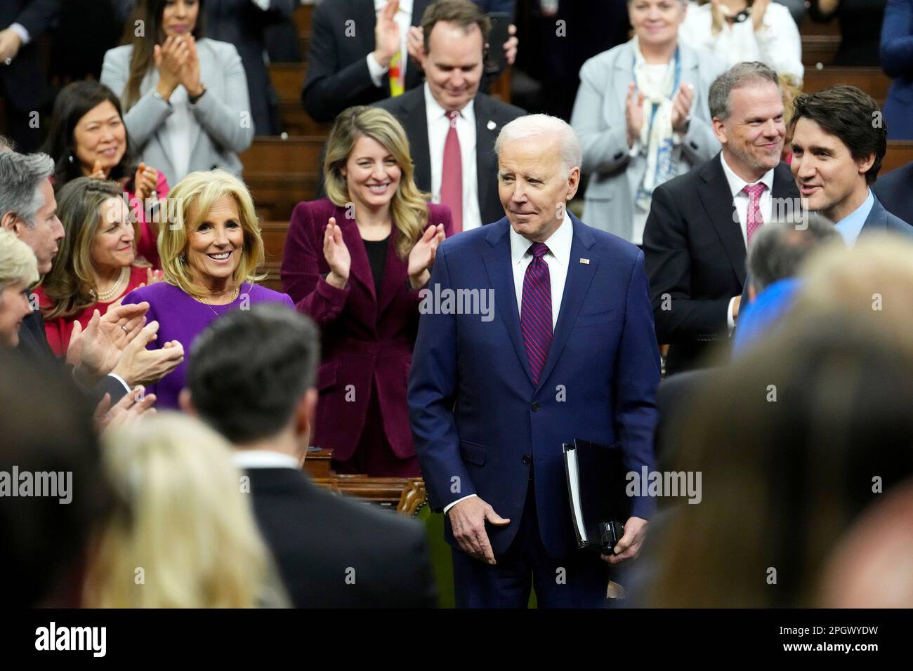 U.S. President Joe Biden and first lady Jill Biden receive an applause ...