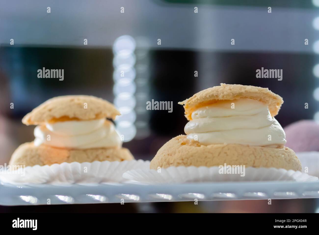 Assortment of fresh cakes with cream on shop counter for sale Stock ...