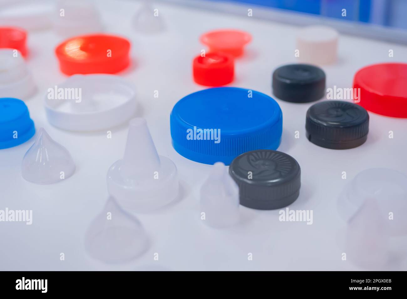 Plastic caps for medical glass bottles in showcase at pharmaceutical ...