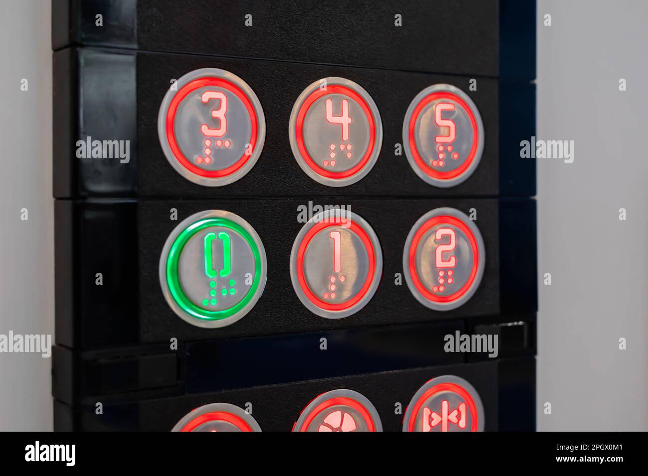 Elevator floor buttons on lift control panel at mall, hotel or business ...