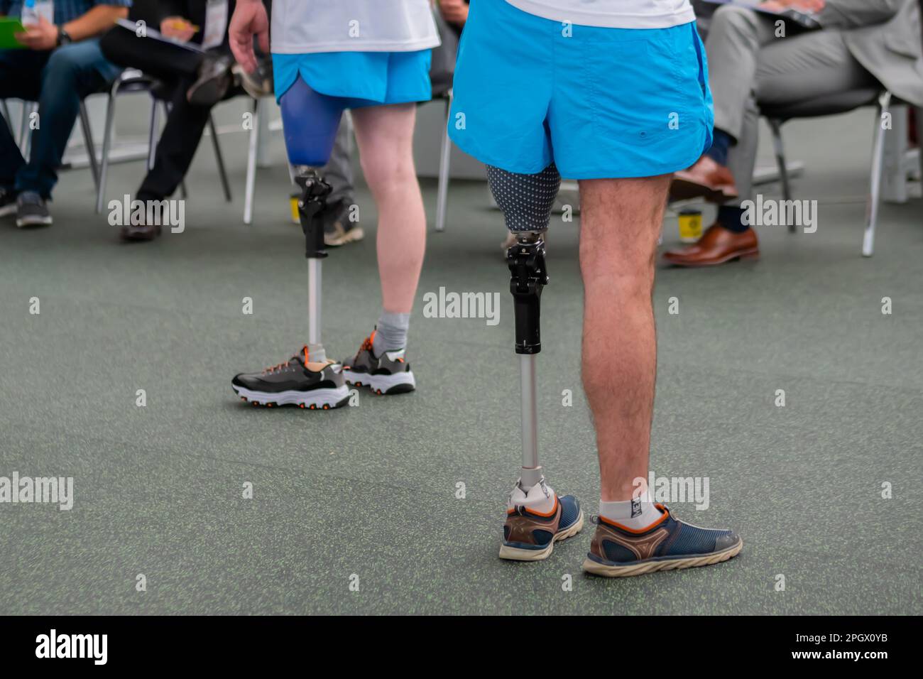 Group of people standing at competition for disabled persons with leg ...