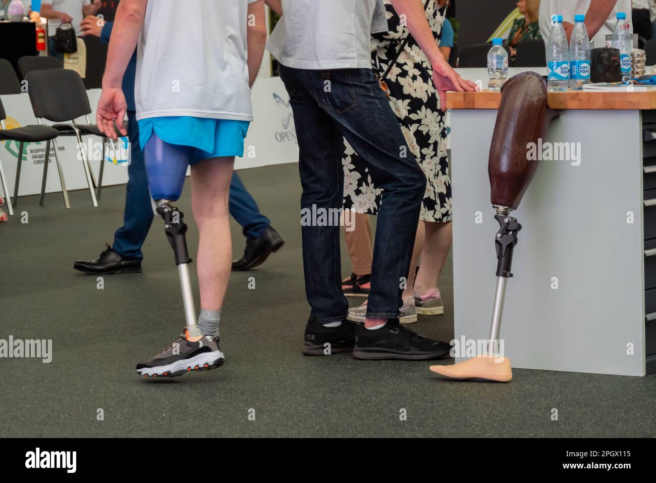 Group of people standing at competition for disabled persons with leg ...