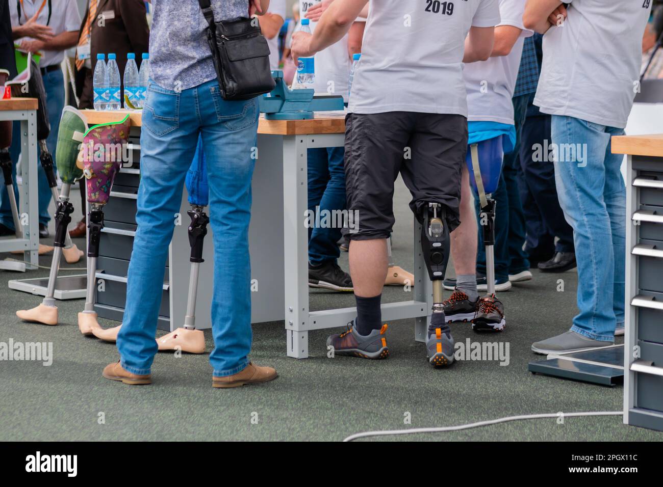 Group of people standing at competition for disabled persons with leg ...