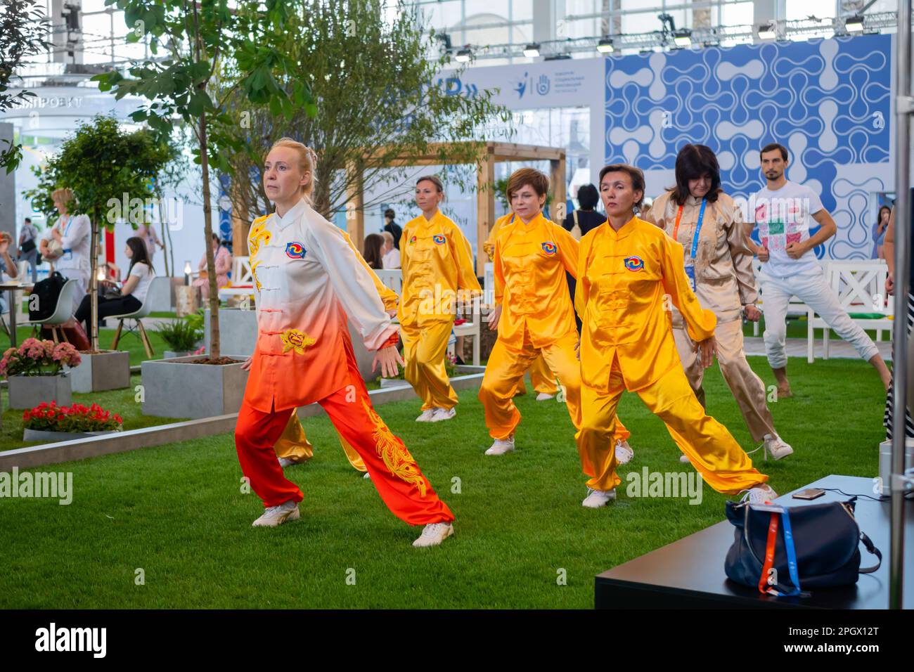 Group of people doing qigong exercise together at exhibition Stock ...