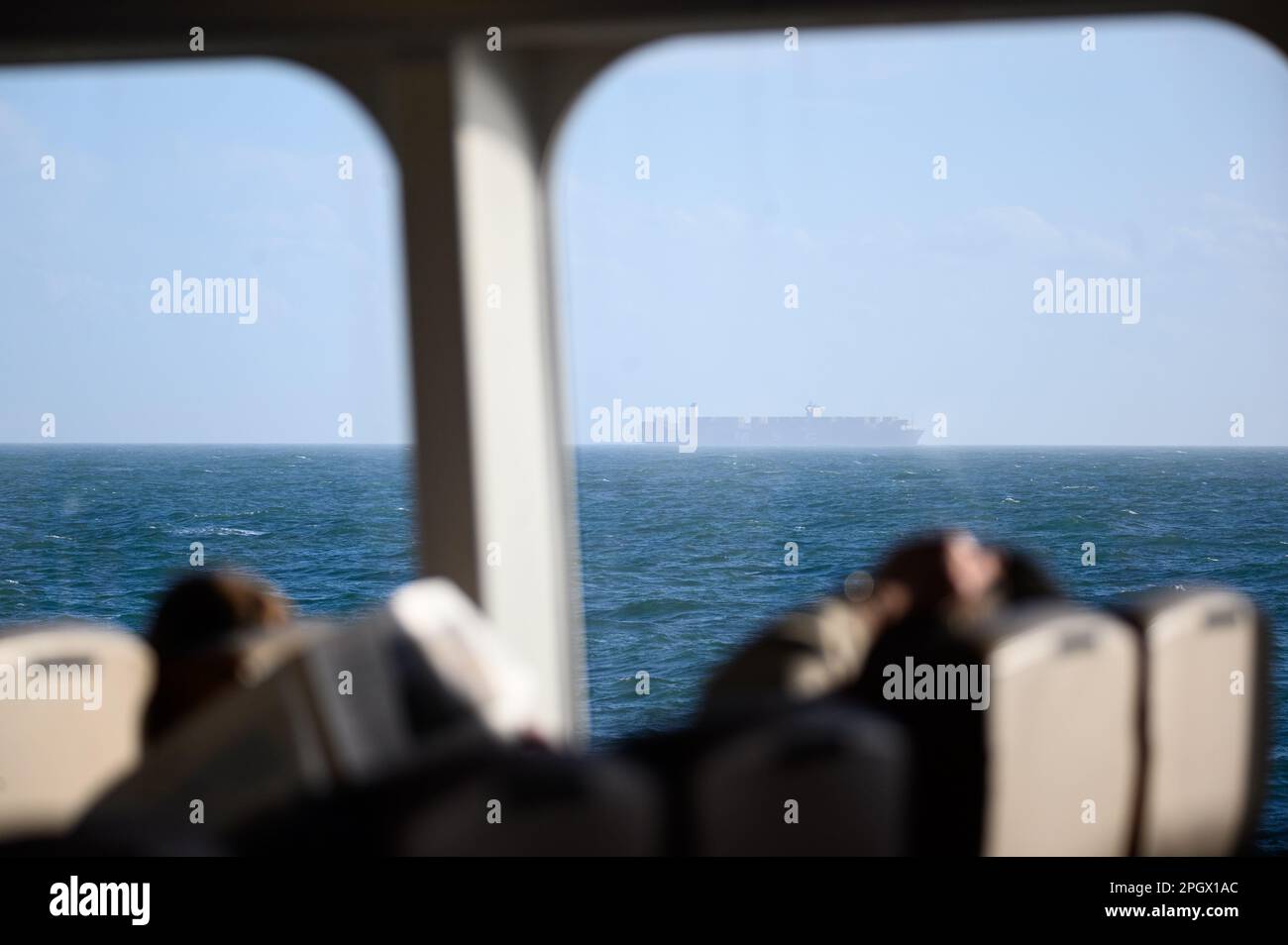 Helgoland, Germany. 24th Mar, 2023. A container ship sailing on the ...