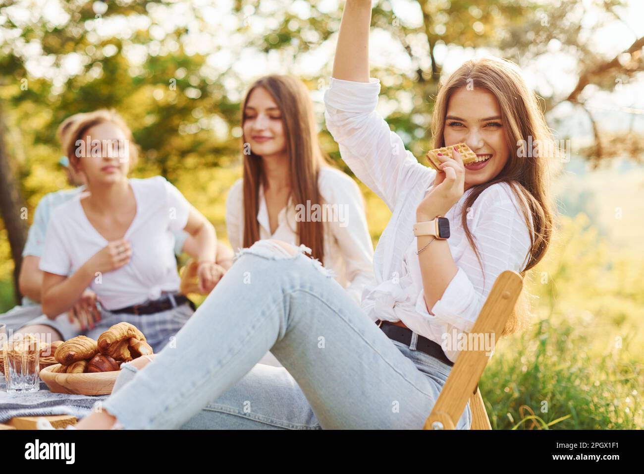 Woman giving high five to photographer. Group of young people have ...