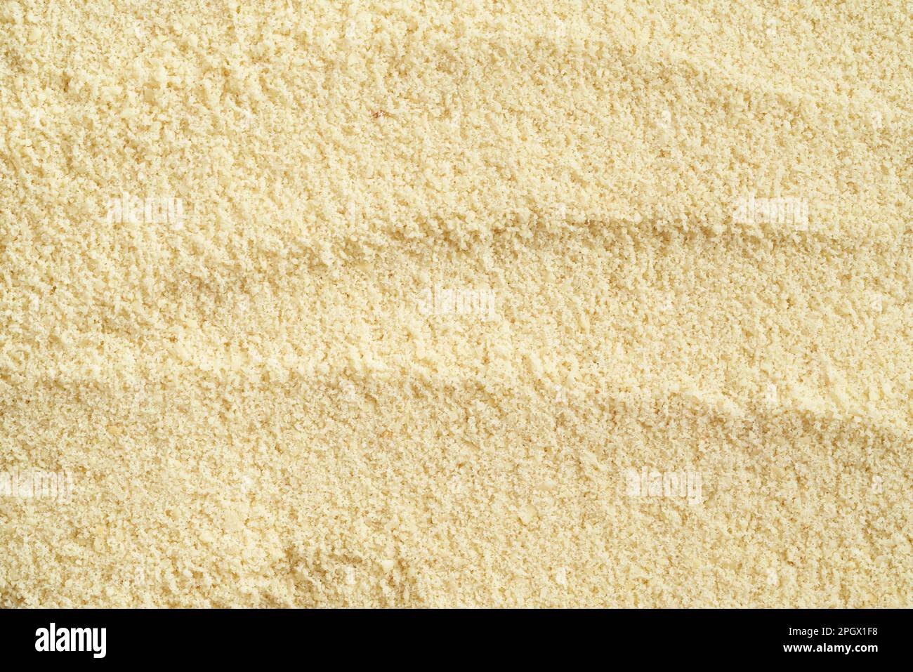 Beige textured background made of almond flour Stock Photo - Alamy
