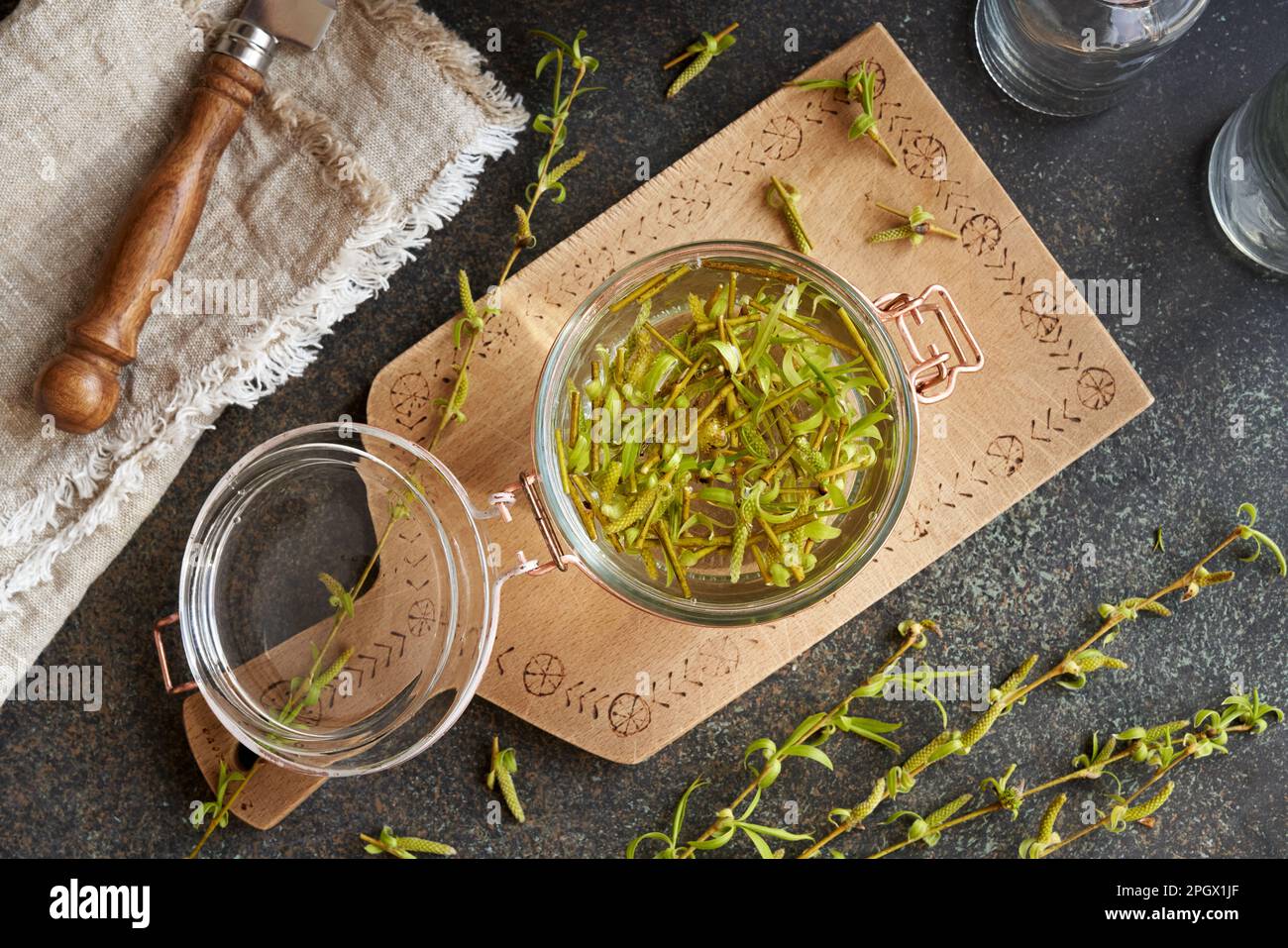 Preparation of herbal tincture from willow buds and bark and alcohol ...