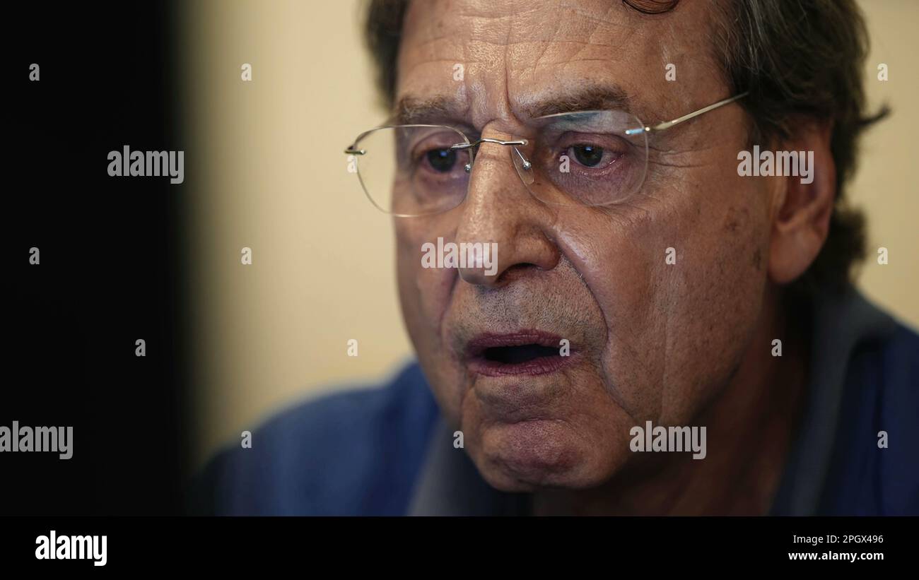 Senior man close up face looking at computer screen at night. Lifestyle ...