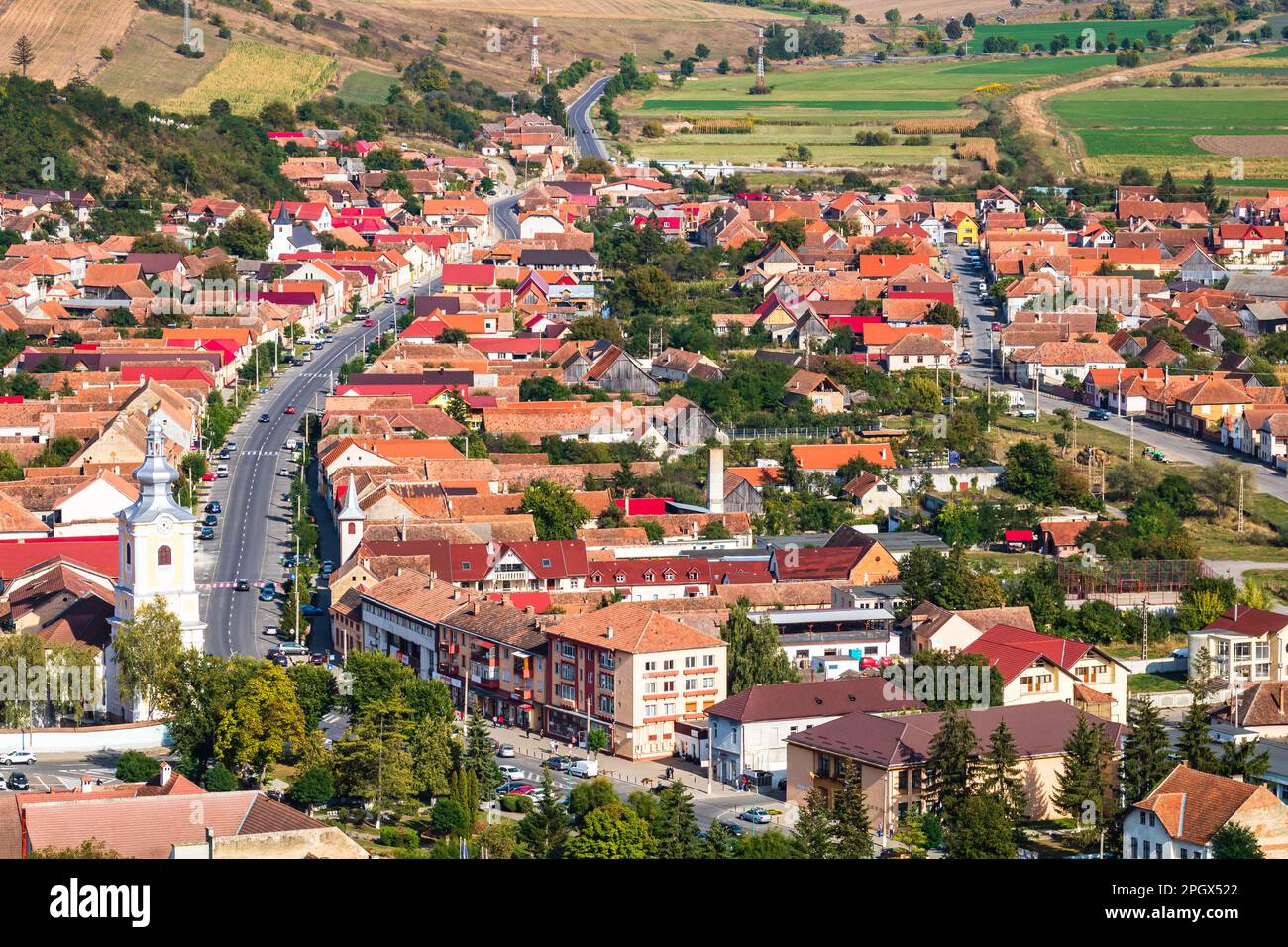 Aerial view of the town center with hills, buildings, streets ...
