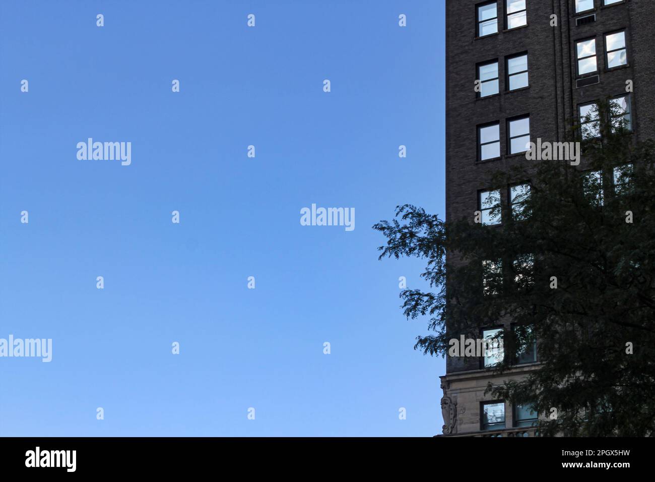 Backlit building with a cloudless blue sky Stock Photo - Alamy