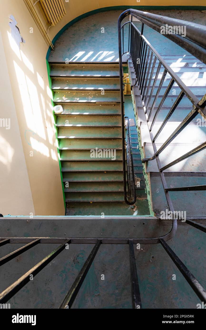 Top view of an old rectangular spiral staircase in an old abandoned ...
