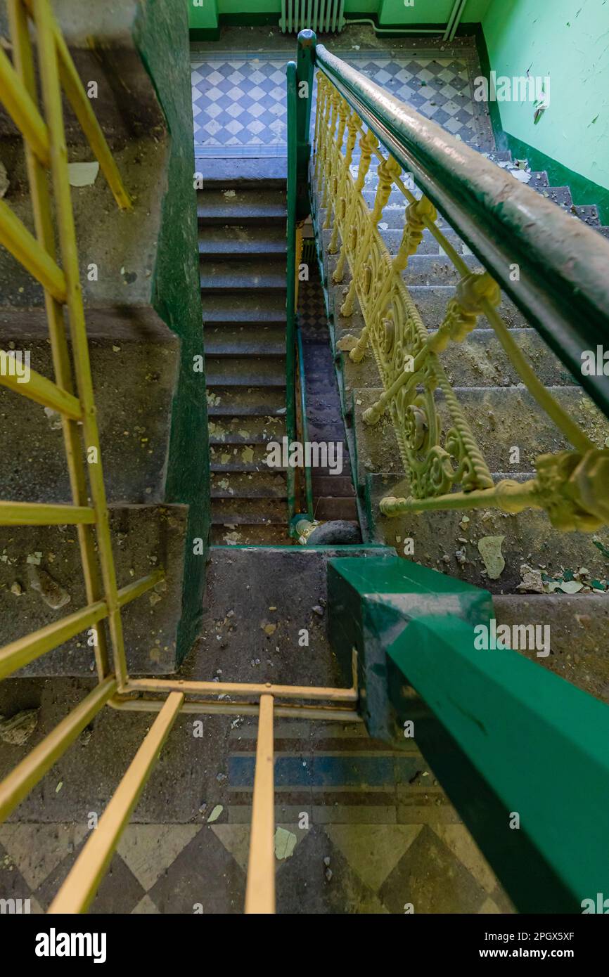 Top view of an old rectangular spiral staircase in an old abandoned ...
