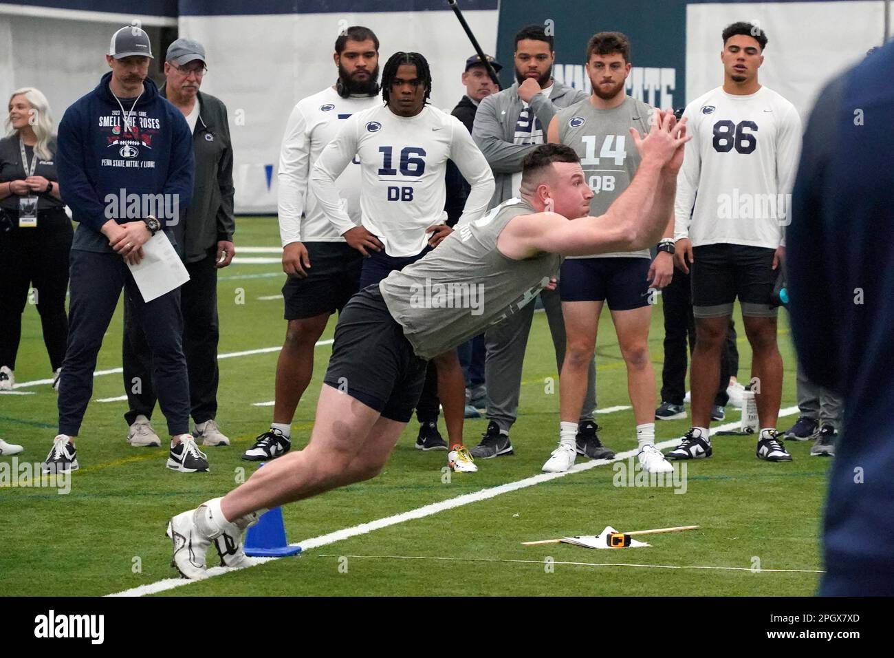 Defensive lineman Nick Tarburton takes off in the Broad Jump during ...