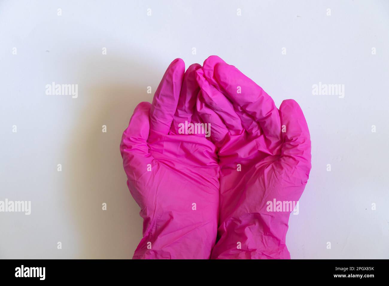 Woman hand pink rubber gloves hi-res stock photography and images - Alamy