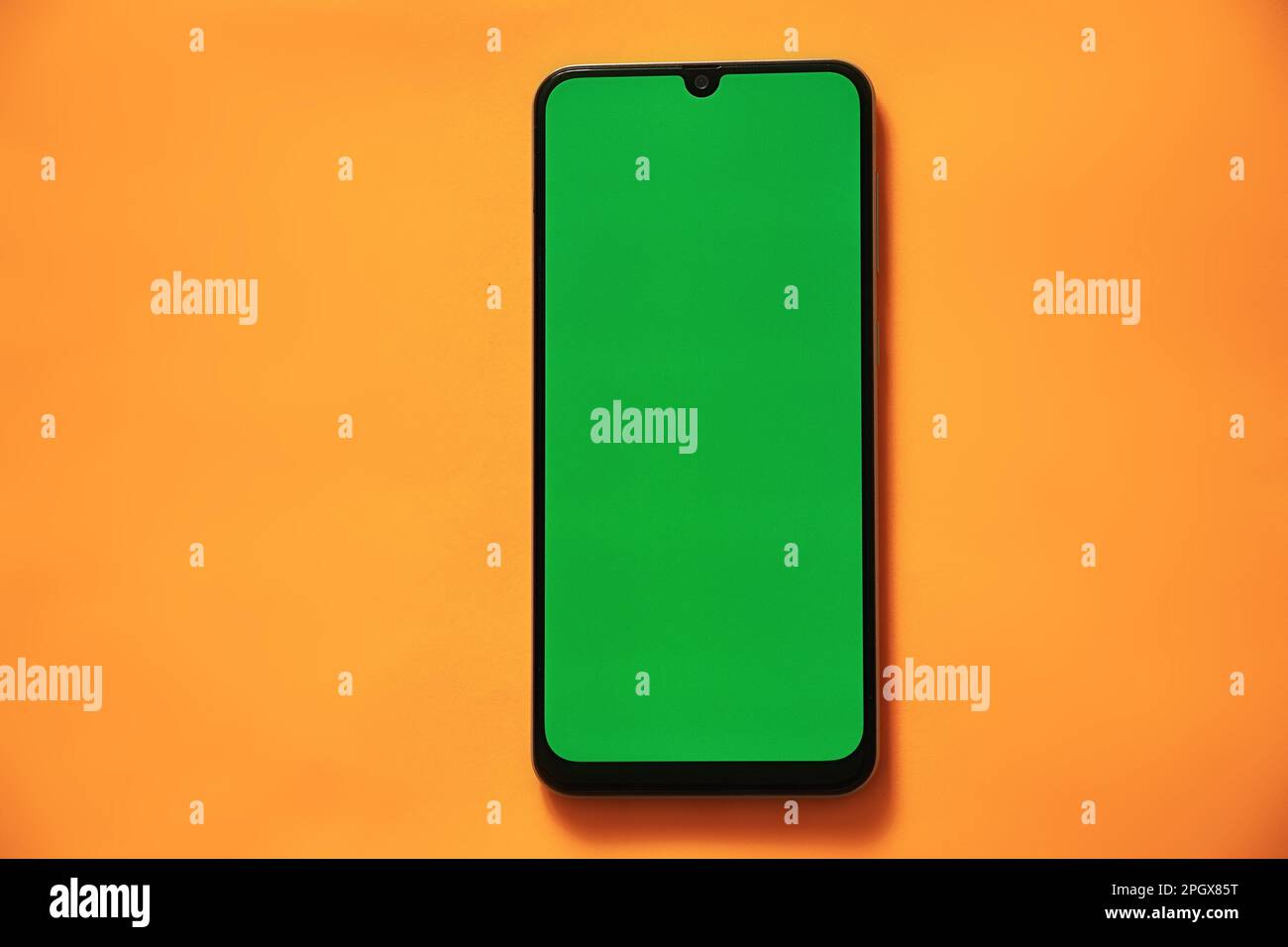 touchscreen phone with a green screen on a light background Stock Photo ...