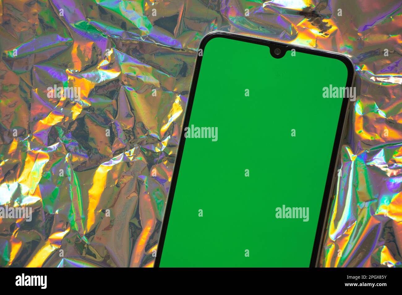 touchscreen phone with a green screen on a light background Stock Photo ...