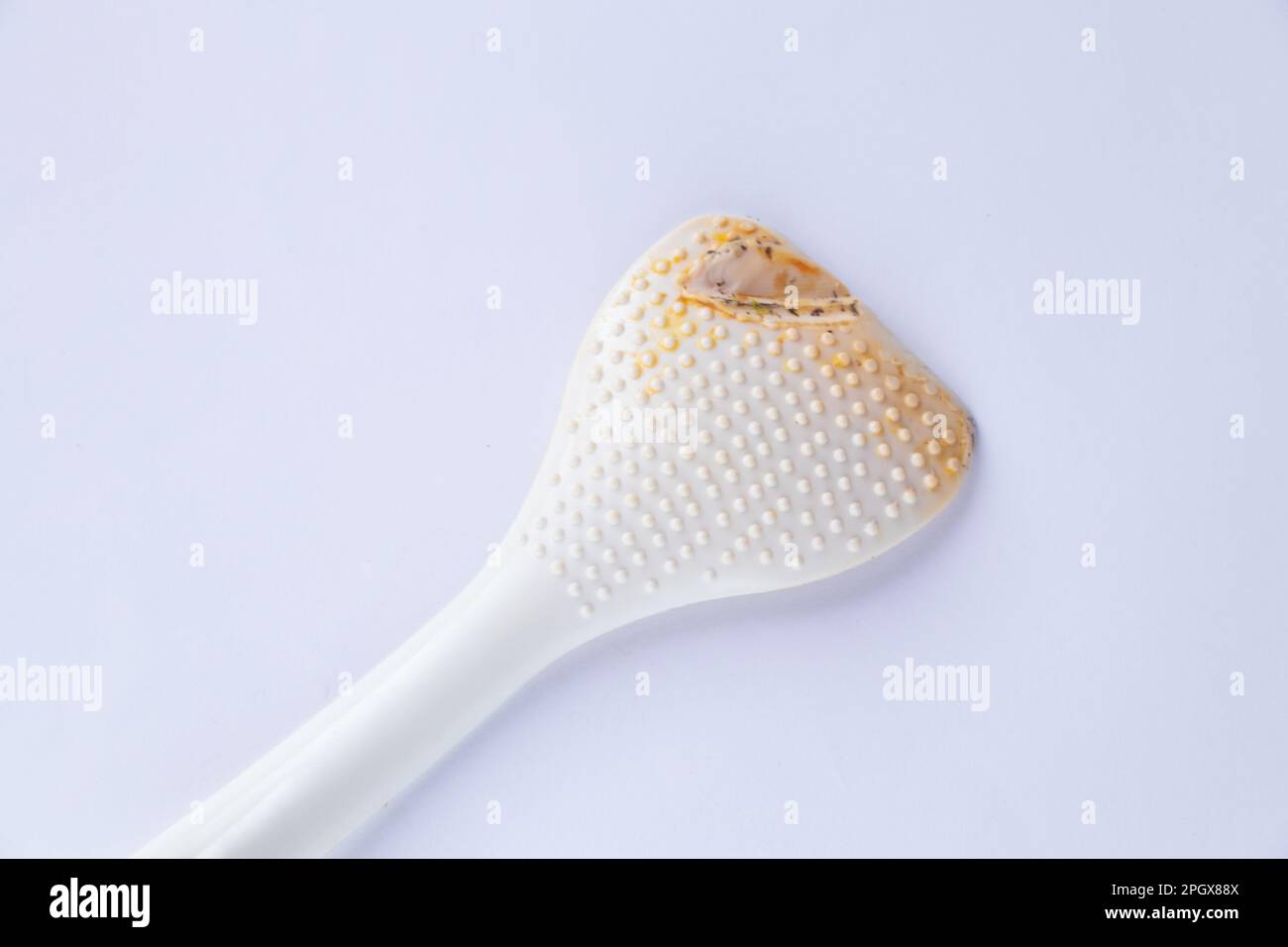 worn plastic spoon for multicooker Stock Photo - Alamy