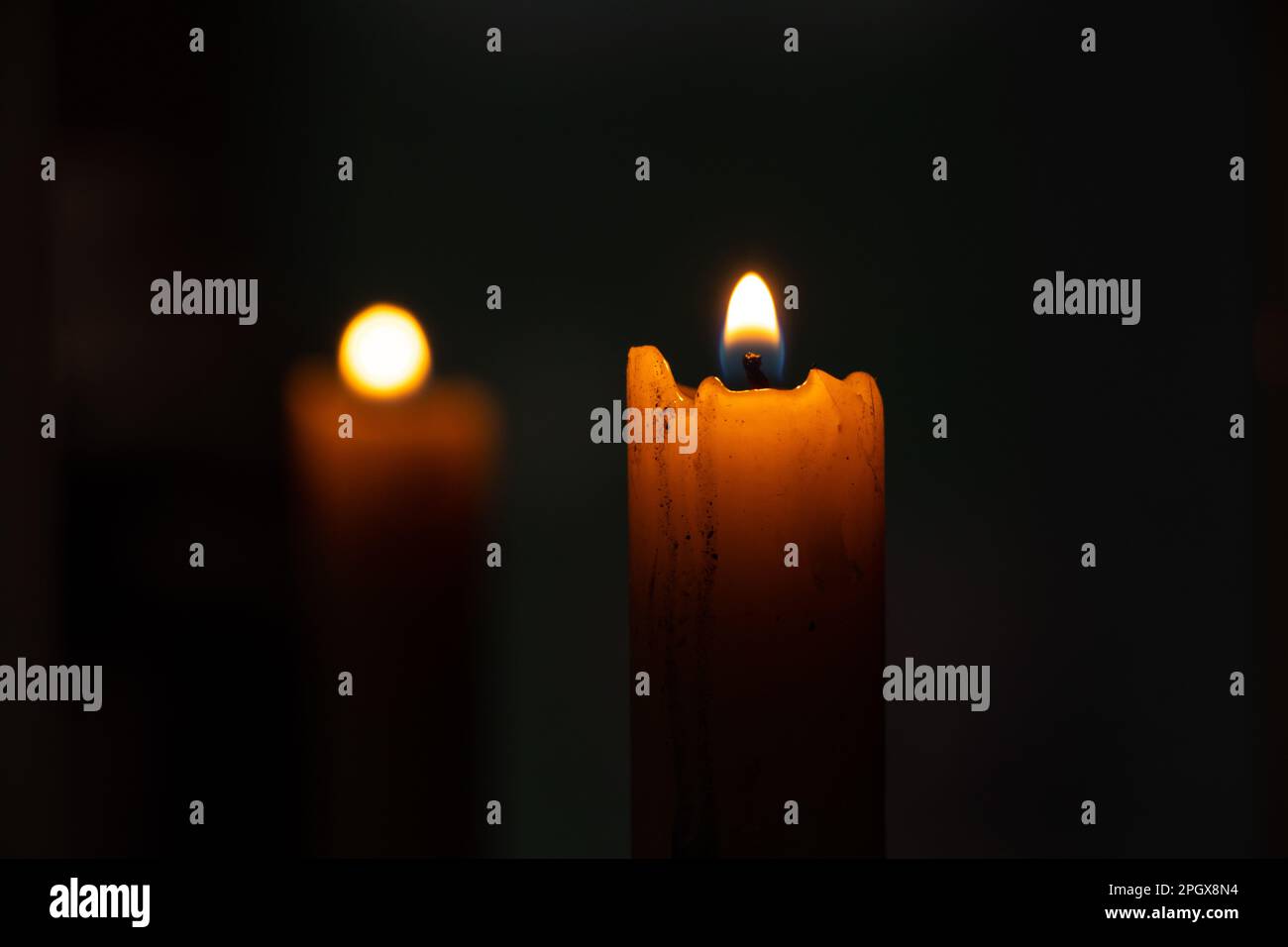 candle fire and back reflection of a candle in a mirror Stock Photo - Alamy