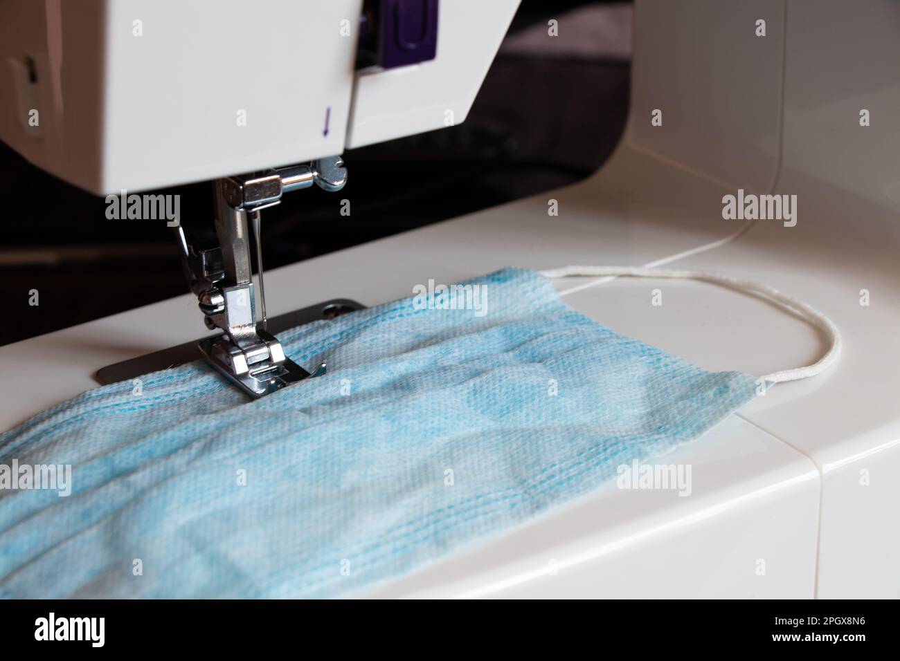 new sewing machine sews a medical mask close-up during Stock Photo - Alamy
