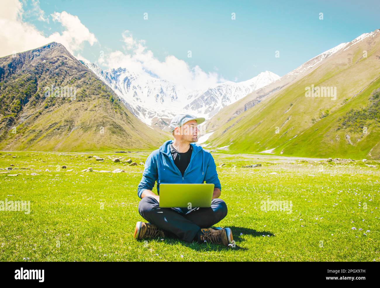 Caucasian handsome guy digital nomad sit work type on laptop with ...